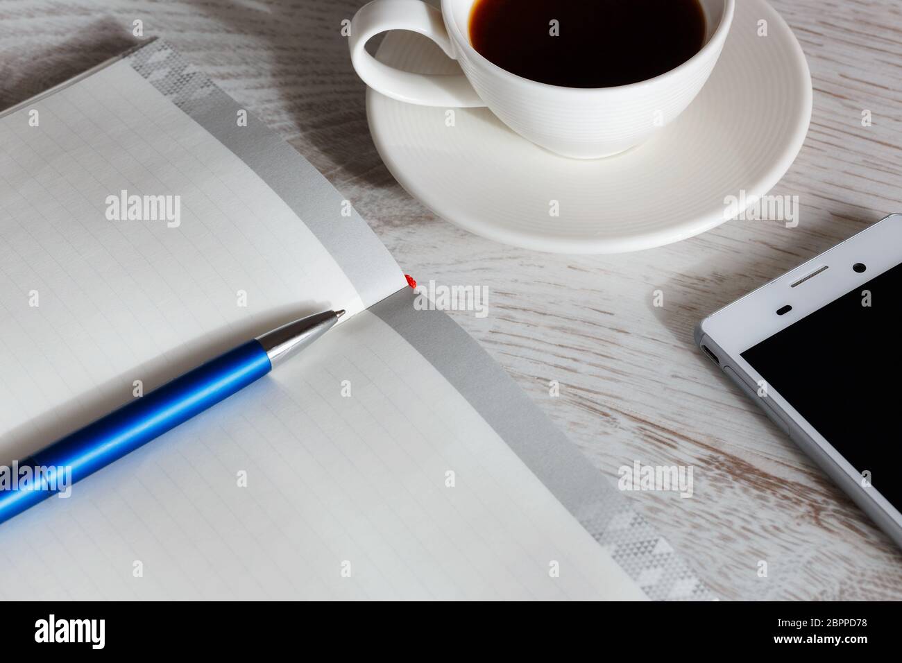 notepad and telephone on the desk, work environment Stock Photo - Alamy