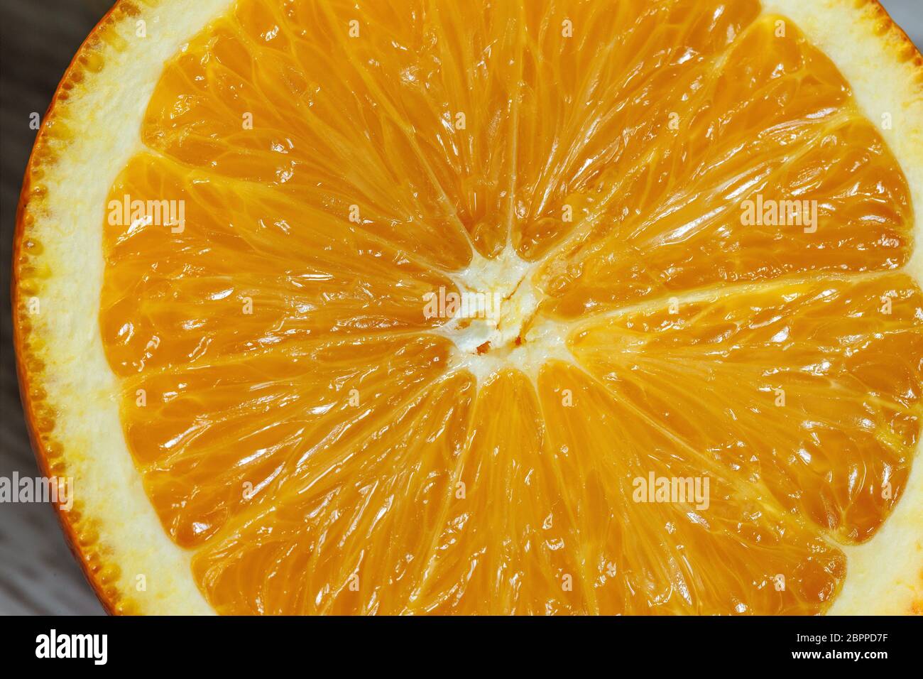 Orange in a cut close-up, piece of tropical fruit Stock Photo - Alamy