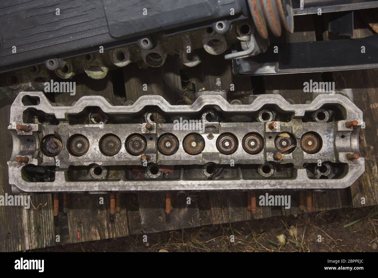 part of an old broken car engine. old cylinder head Stock Photo - Alamy