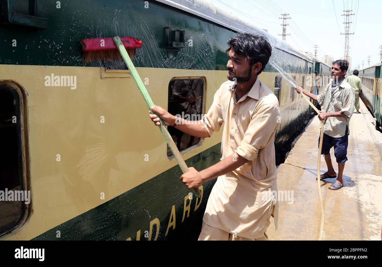 Workers of Railway Department busy in washing trains, to earn their ...