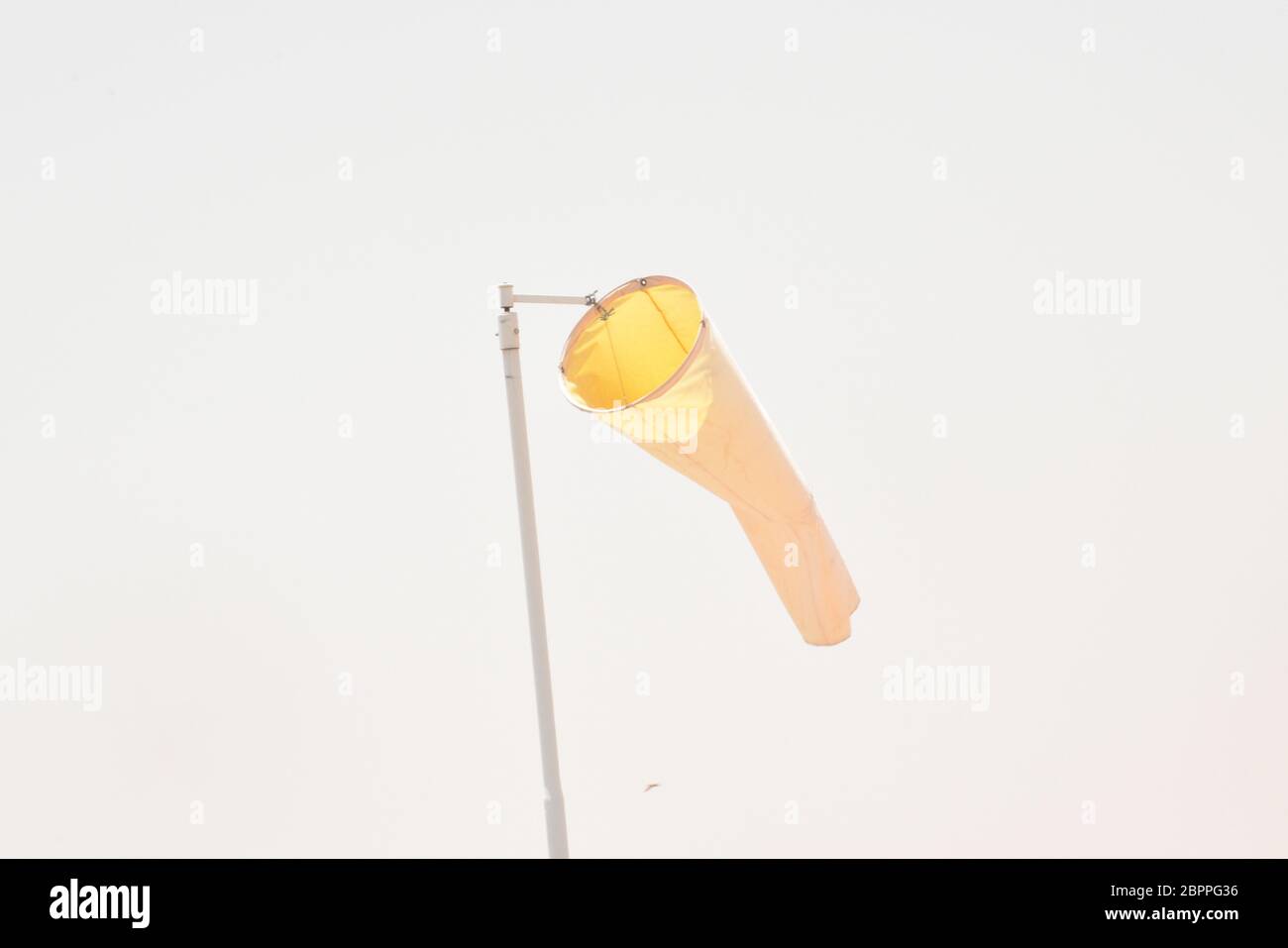 Orange wind sock against blue sky.Wind sock of equipment check the wind ...