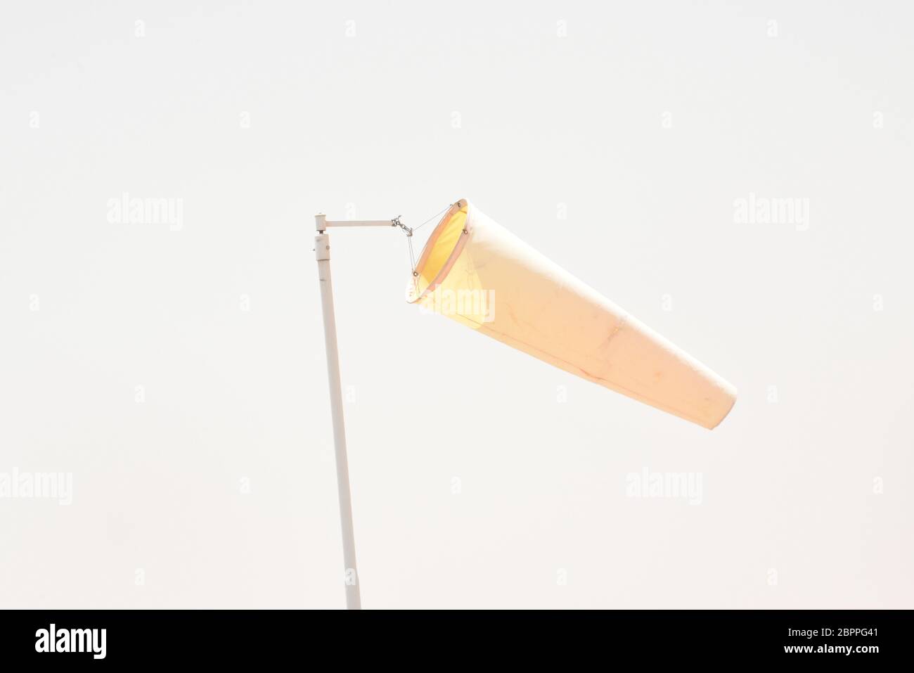 Orange wind sock against blue sky.Wind sock of equipment check the wind ...