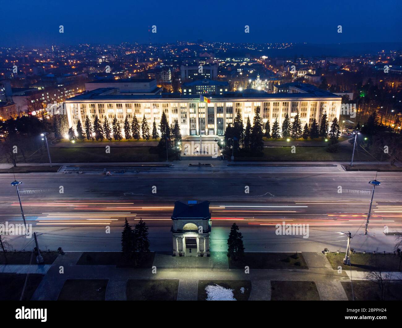 Aerial drone view of chisinau city center at night with light and blue ...