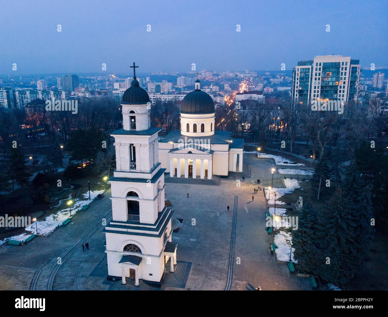Aerial drone view of chisinau city center at night with lights and blue ...