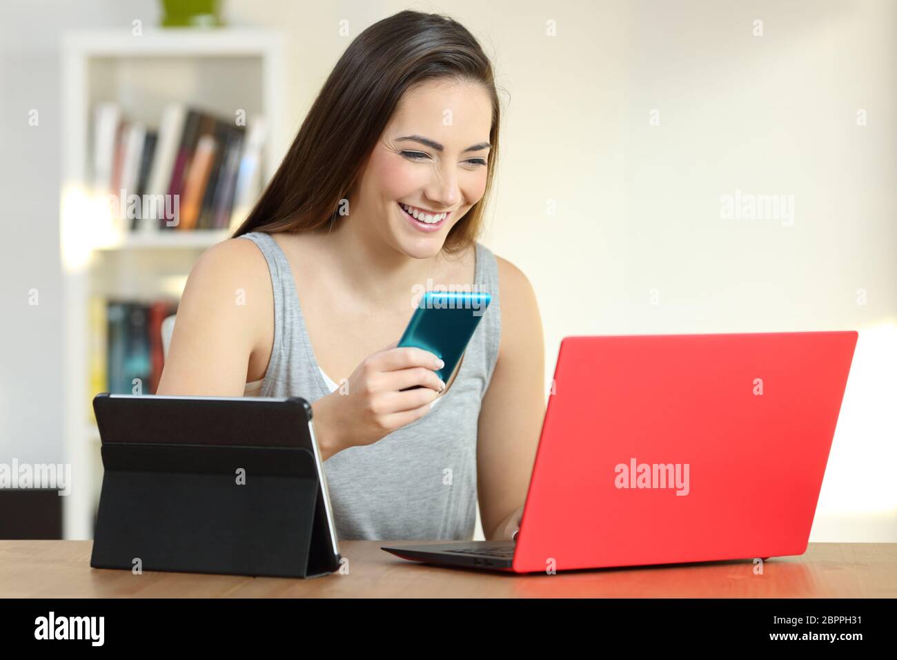 Using multiple devices hi-res stock photography and images - Alamy