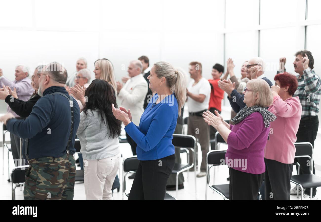 Audience applaud with raised hands in the meeting Stock Photo - Alamy
