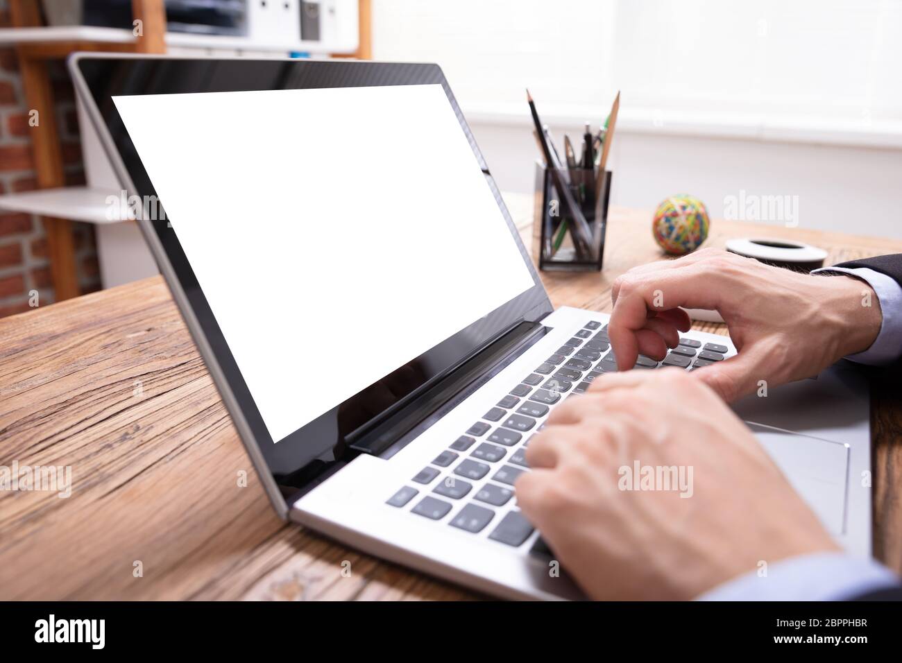 Businessman's Hand Touching Laptop With Blank White Screen Stock Photo ...