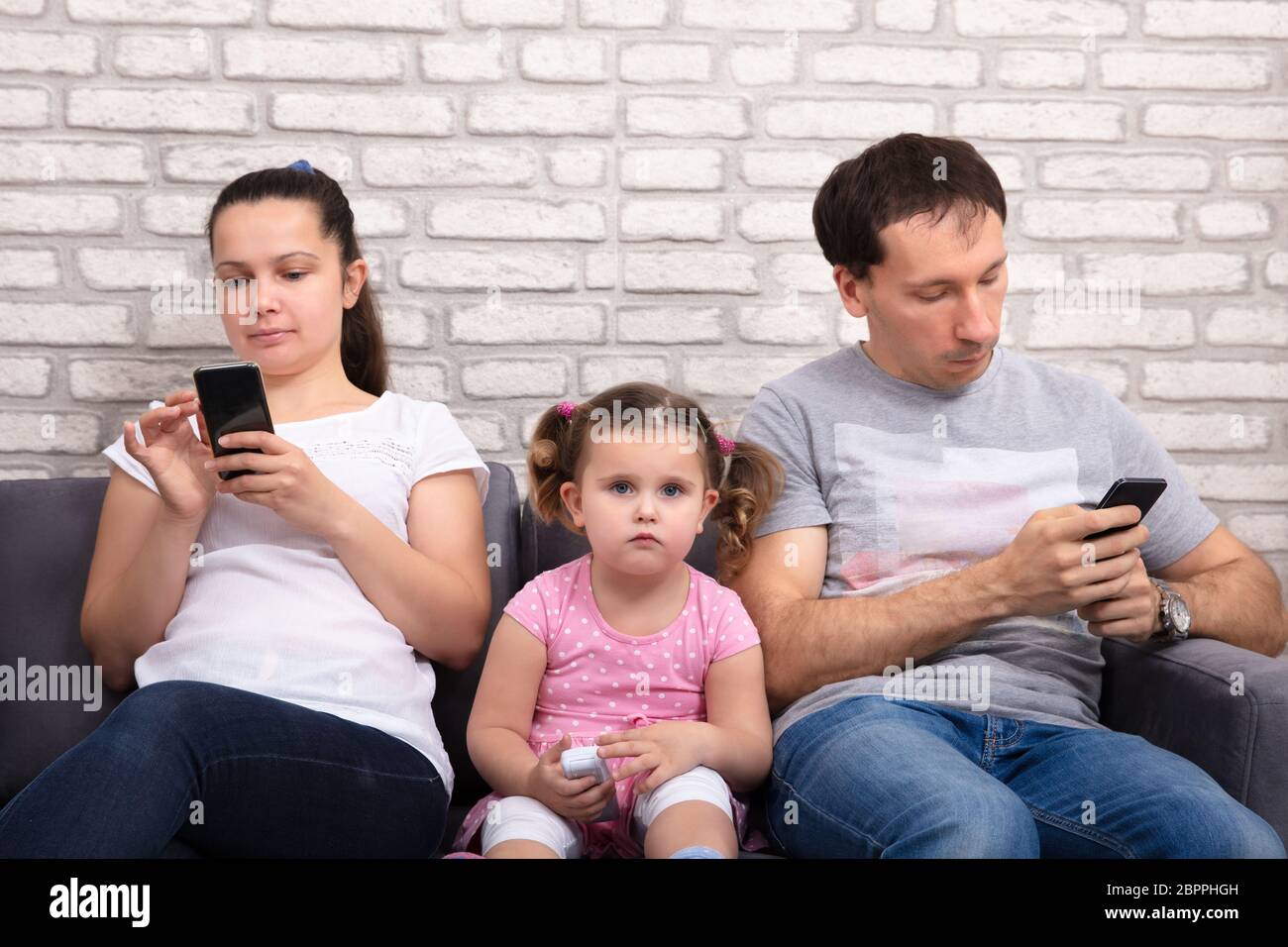 Parent mobile ignoring child hi-res stock photography and images - Alamy