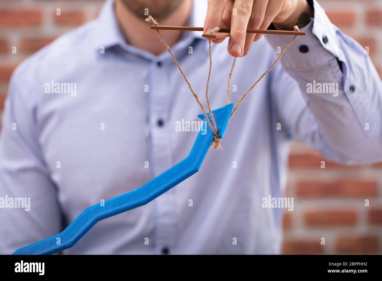 Hand controlling strings puppet businessman hi-res stock photography ...