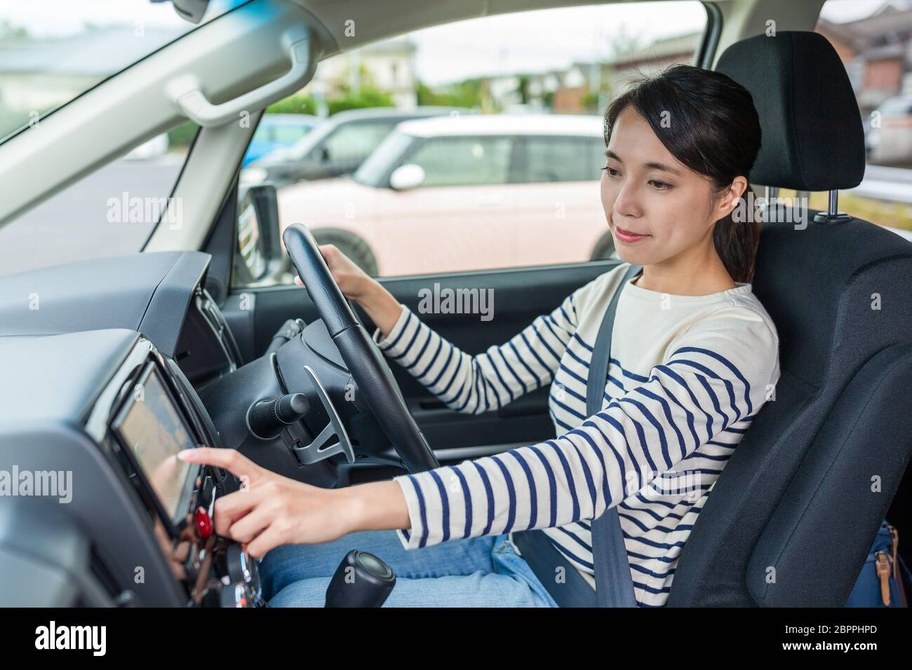 Woman driving car and using GPS system Stock Photo - Alamy