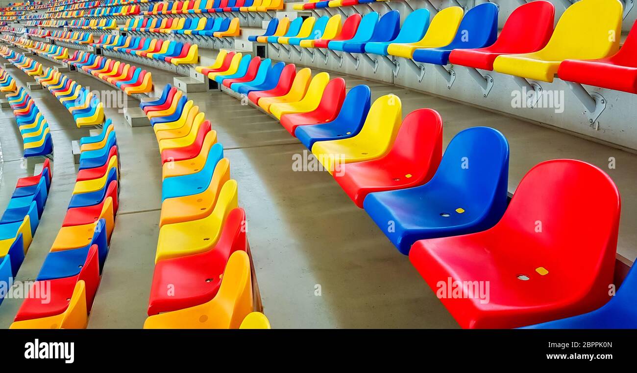 Colorful benches in a stadium Stock Photo - Alamy
