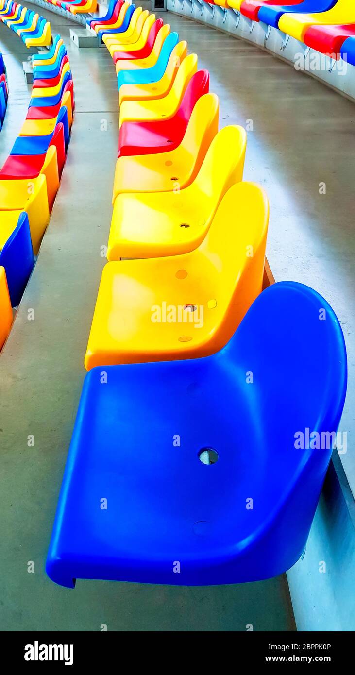 Colorful benches in a stadium Stock Photo - Alamy