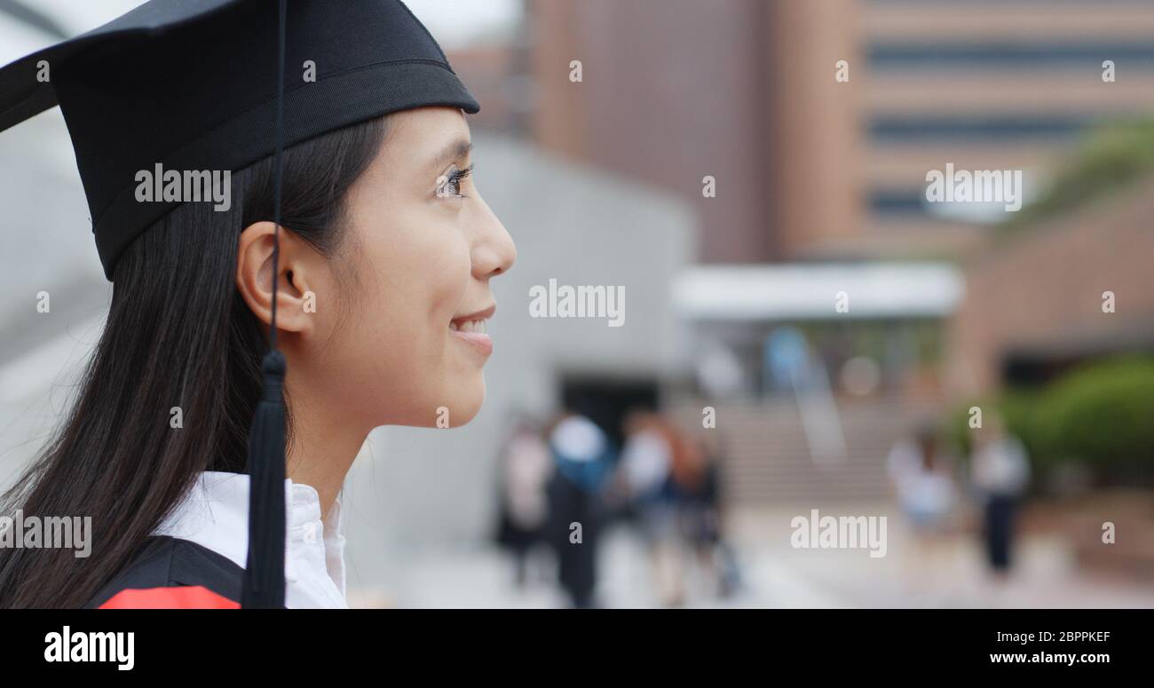 Side profile of graduation woman look far away Stock Photo - Alamy