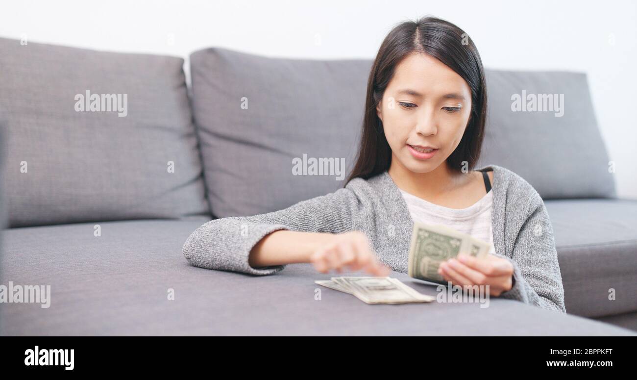 Woman counting money banknote Stock Photo - Alamy