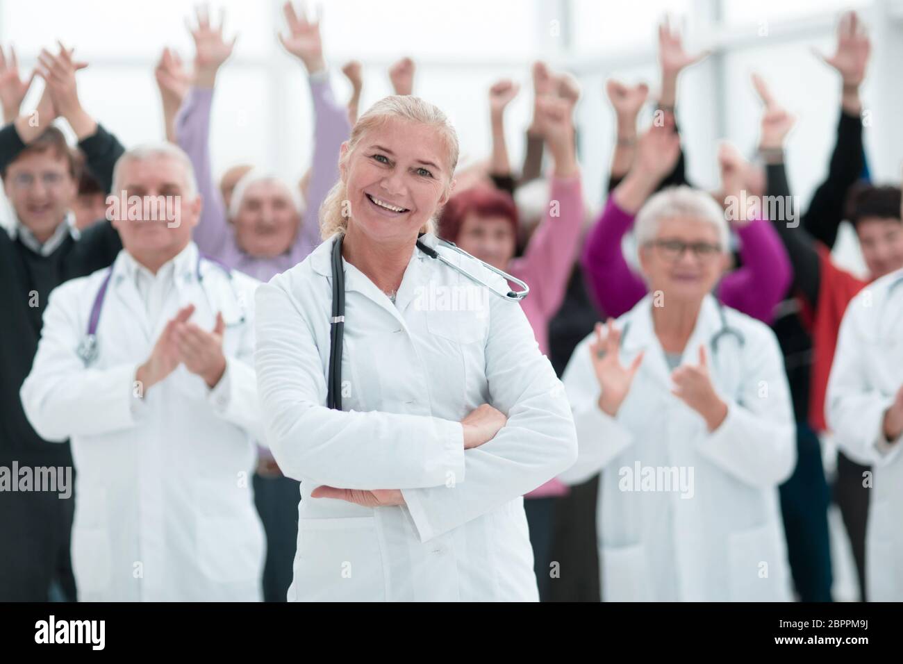Group doctors and patients clapping their hands to celebrate recovery ...