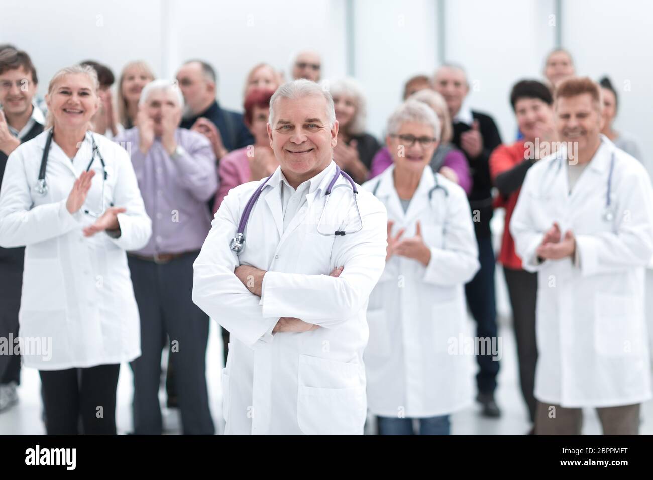 Group doctors and patients clapping their hands to celebrate recovery ...