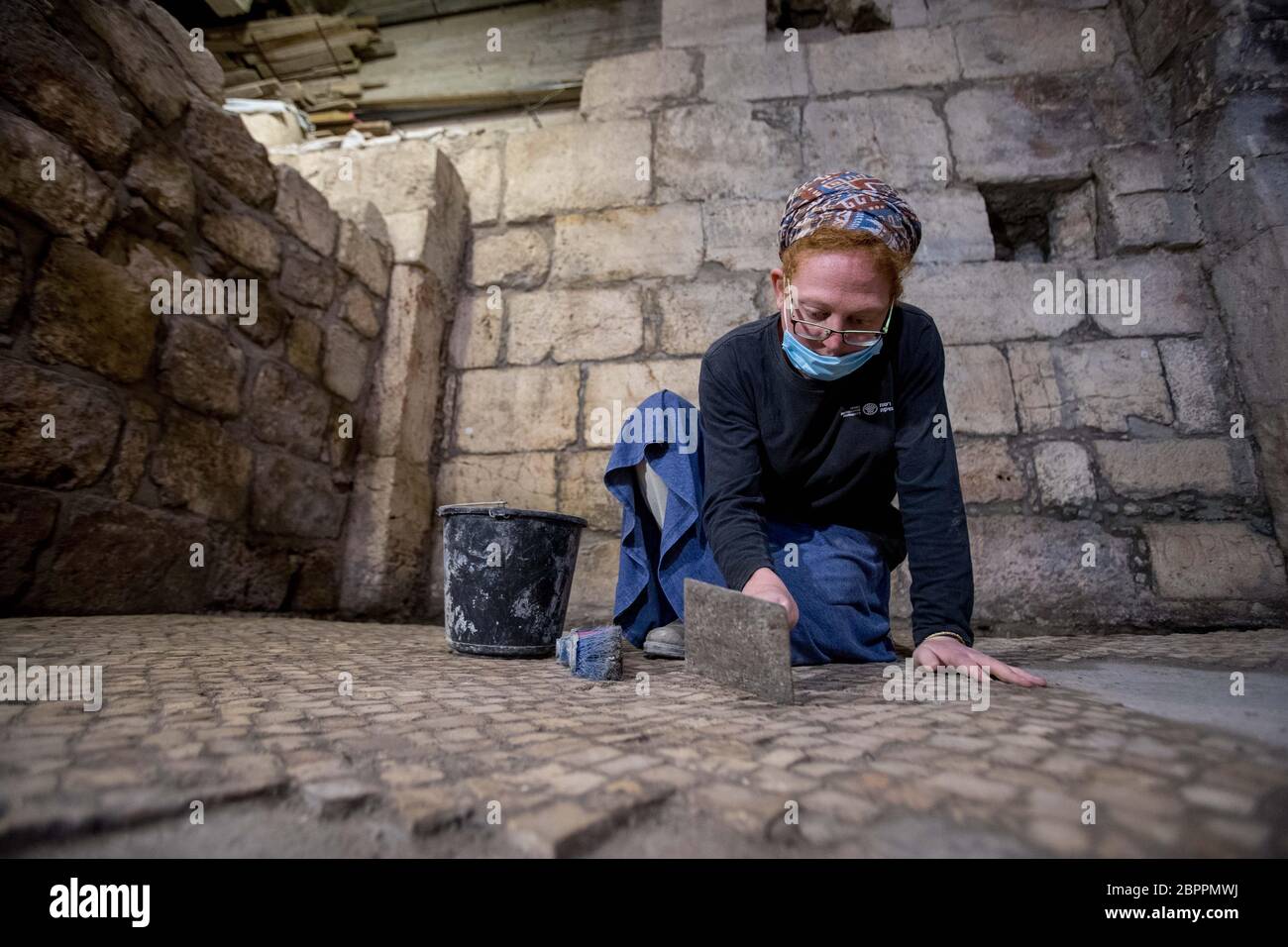 Jerusalem, Israel. 19th May, 2020. An Israeli archaeologist works at an ...