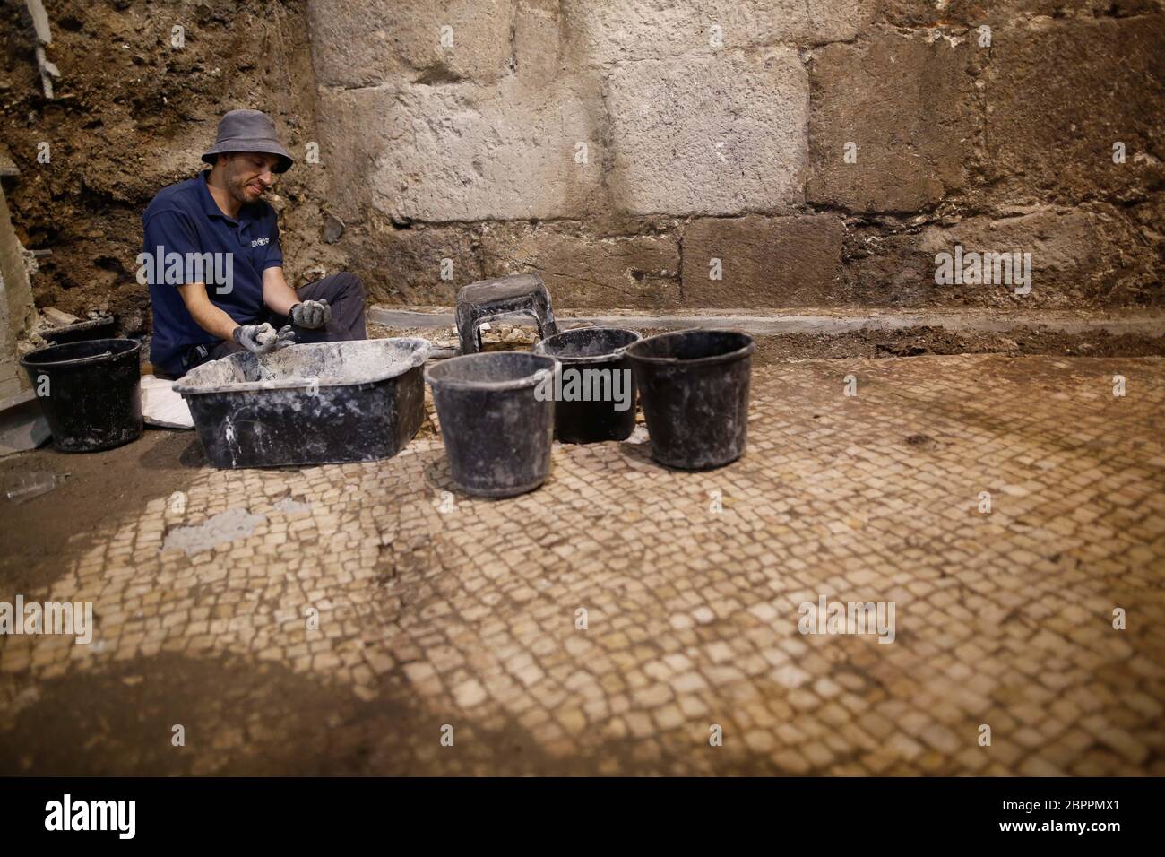 Jerusalem, Israel. 19th May, 2020. An Israeli archaeologist works at an ...
