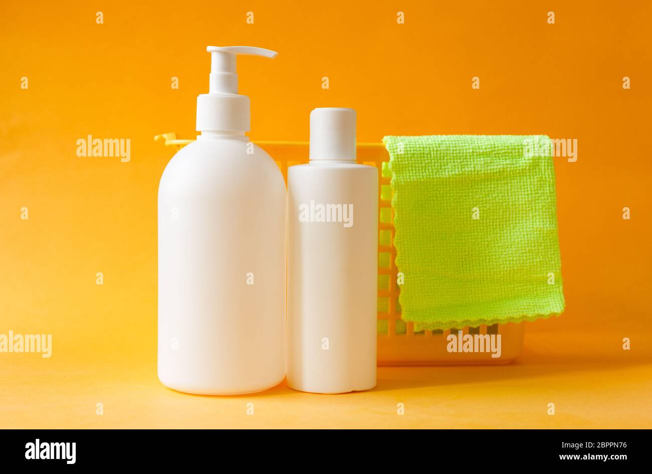 Two Bottles and containers with household chemicals for cleaning floors ...