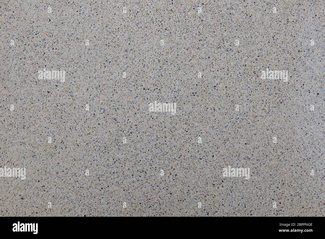 Close up small tiny stone pebble in concrete floor texture background ...