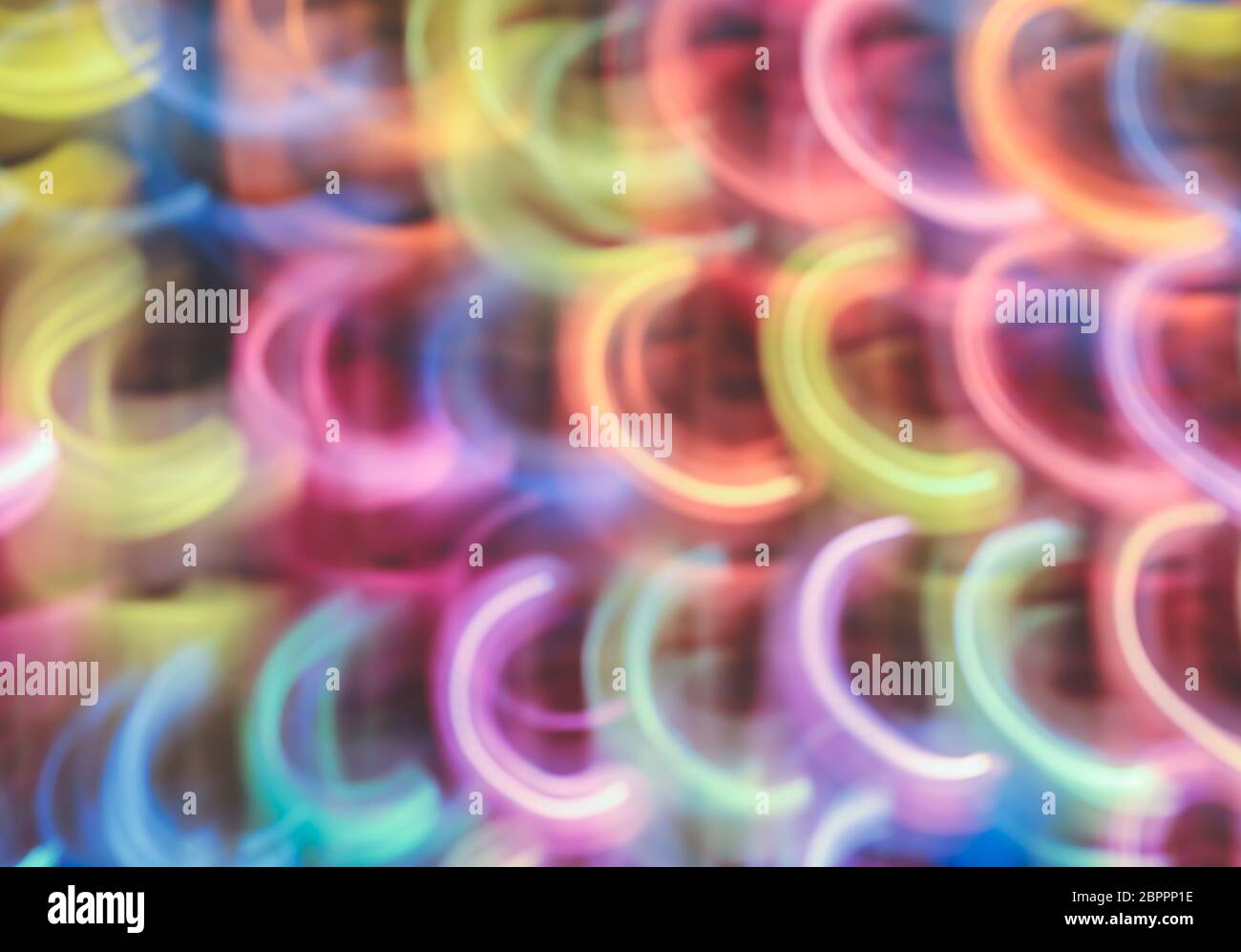 Abstract colorful background of neon lights on street with long ...