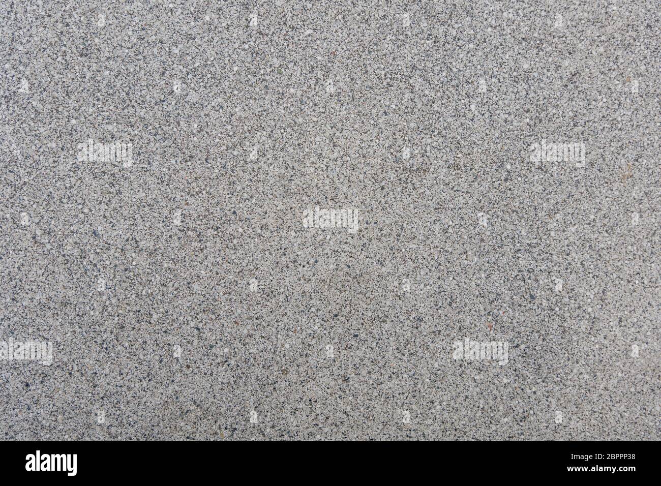 Close up small tiny stone pebble in concrete floor texture background ...