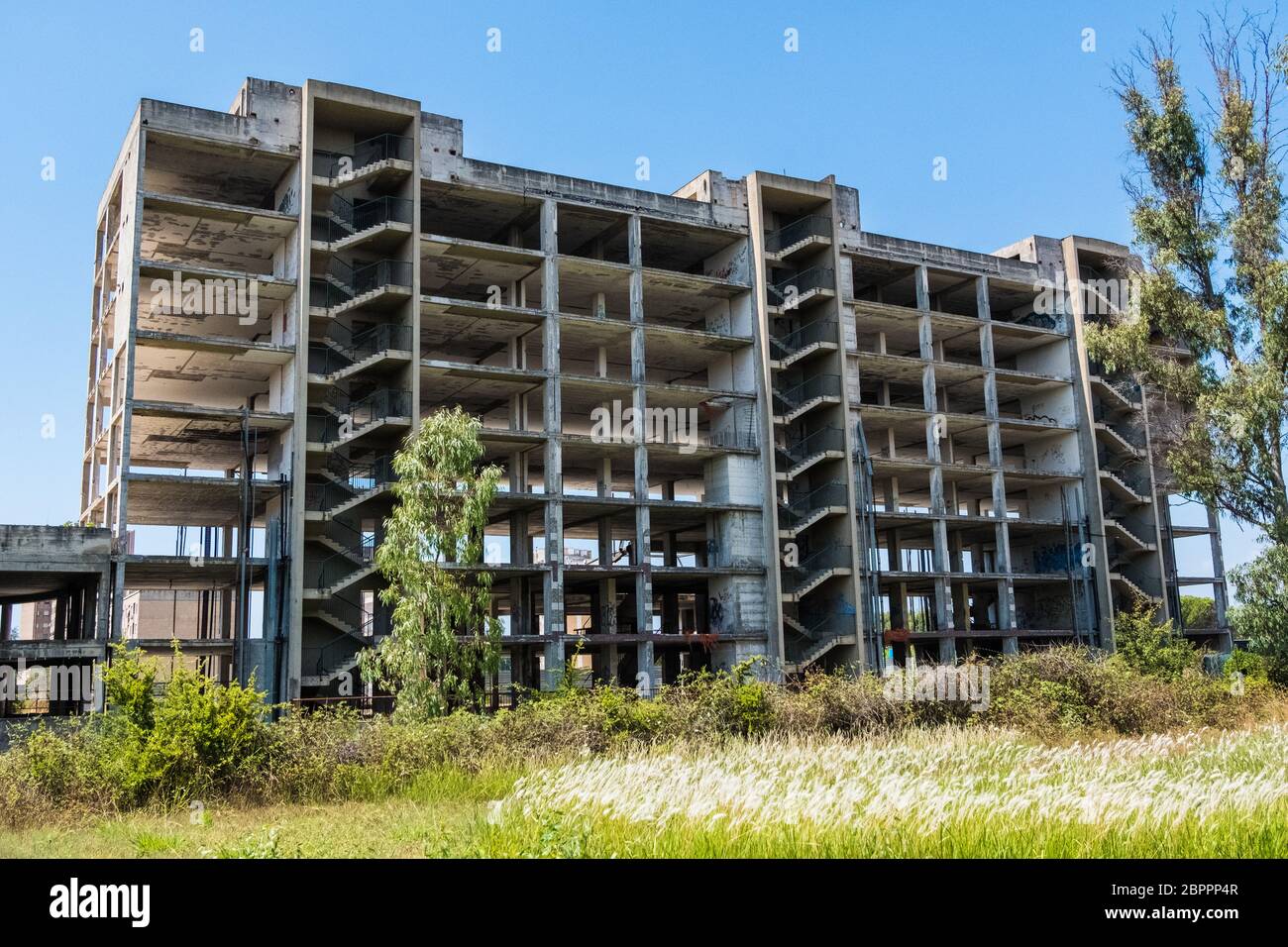 Huge multi floors concrete structure of abandoned building with stairs ...