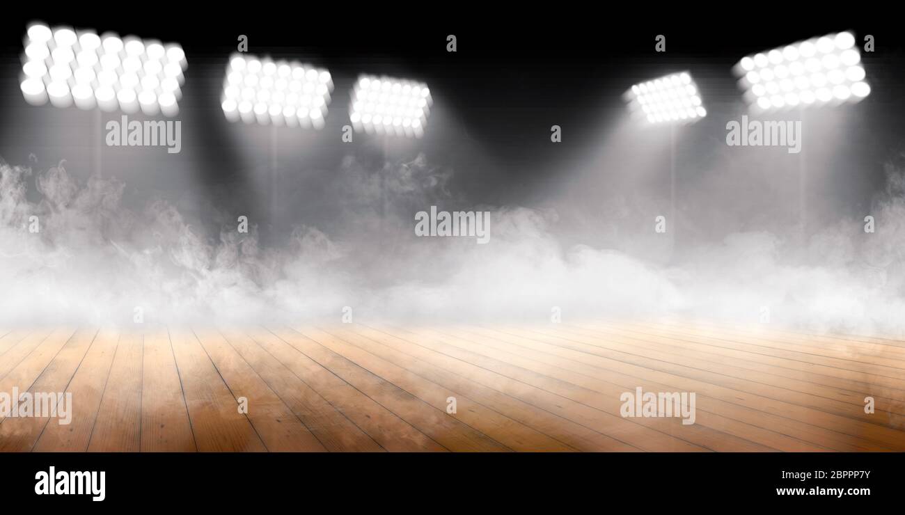 Sports arena with wooden floor with smokes and spotlights against dark ...