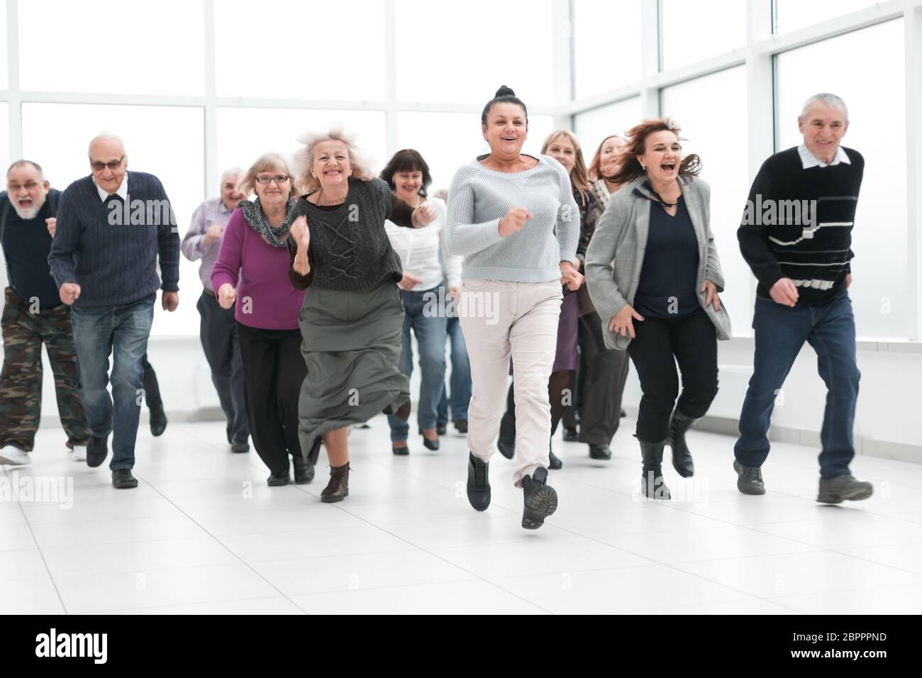 Running people concept of a winner Stock Photo - Alamy