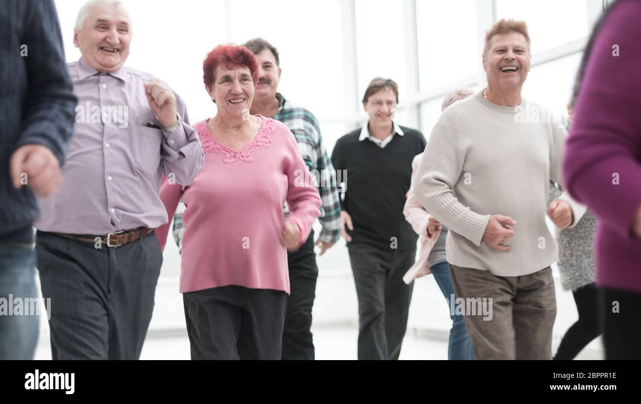 Running people concept of a winner Stock Photo - Alamy