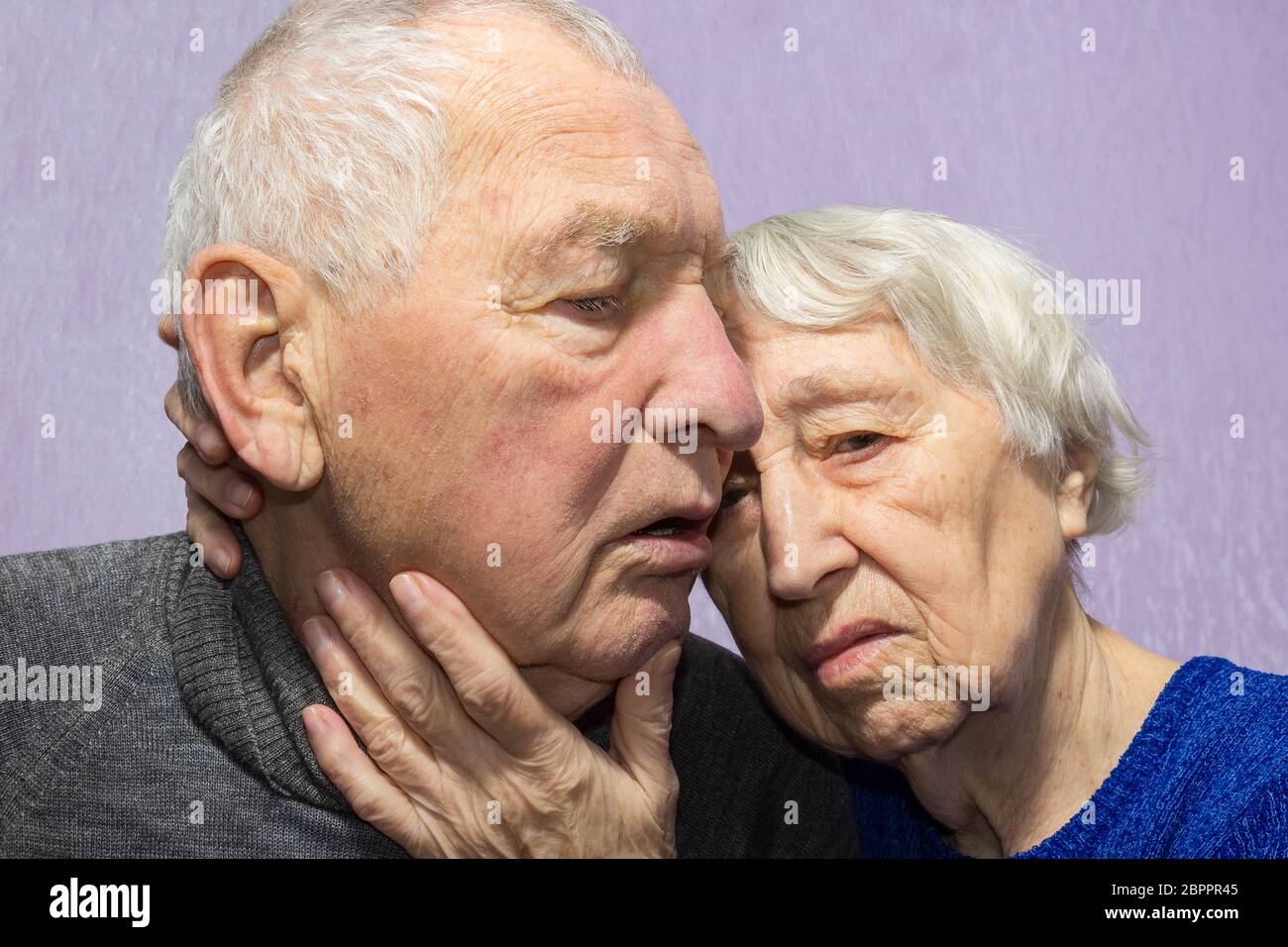 Portrait of a sad sick elder couple at home. The senior people and ...