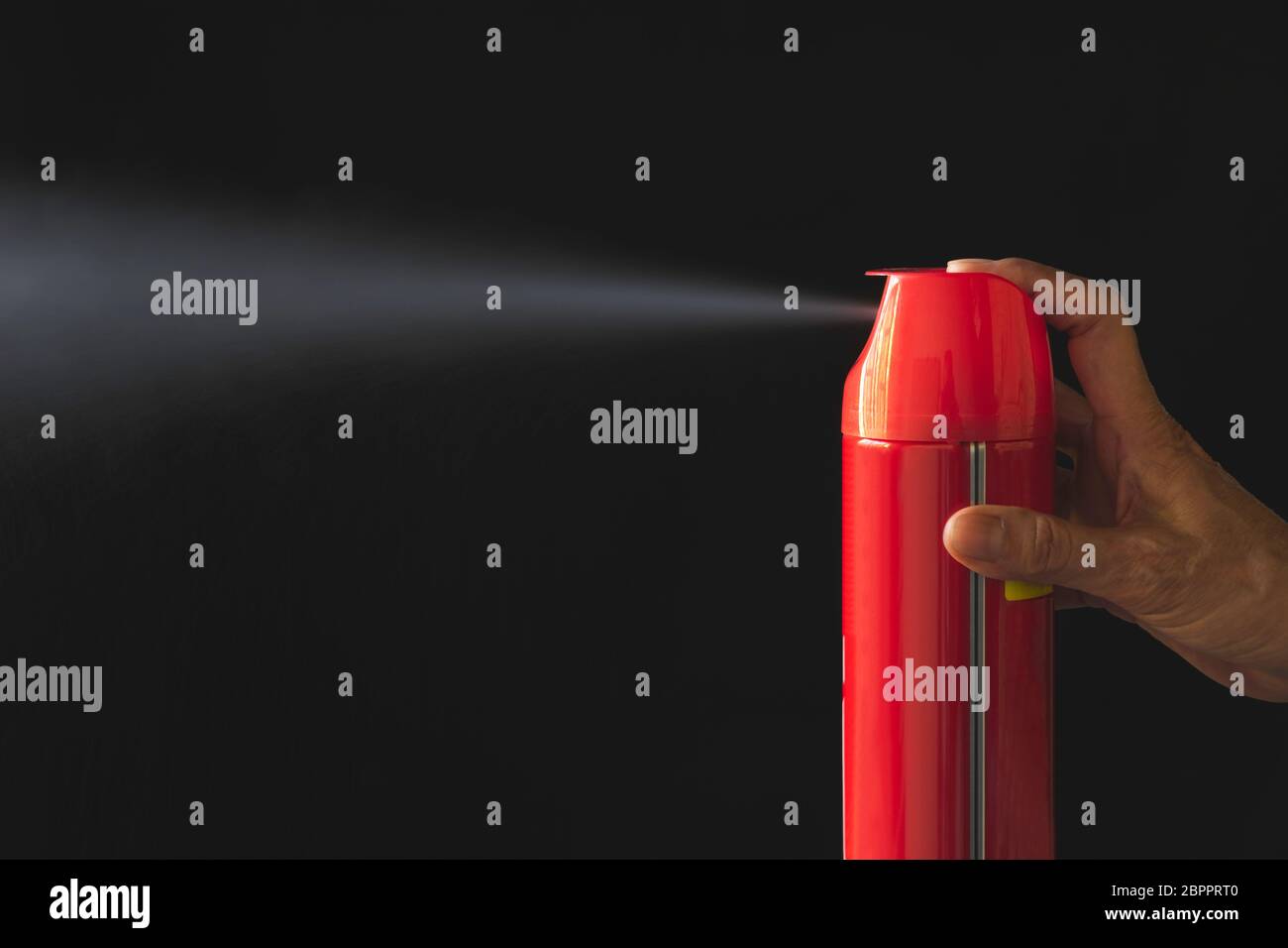 Hand holding mosquito spray. Human using mosquito spray from bottle ...