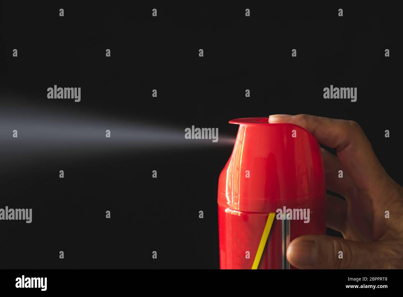 Hand holding mosquito spray. Human using mosquito spray from bottle ...