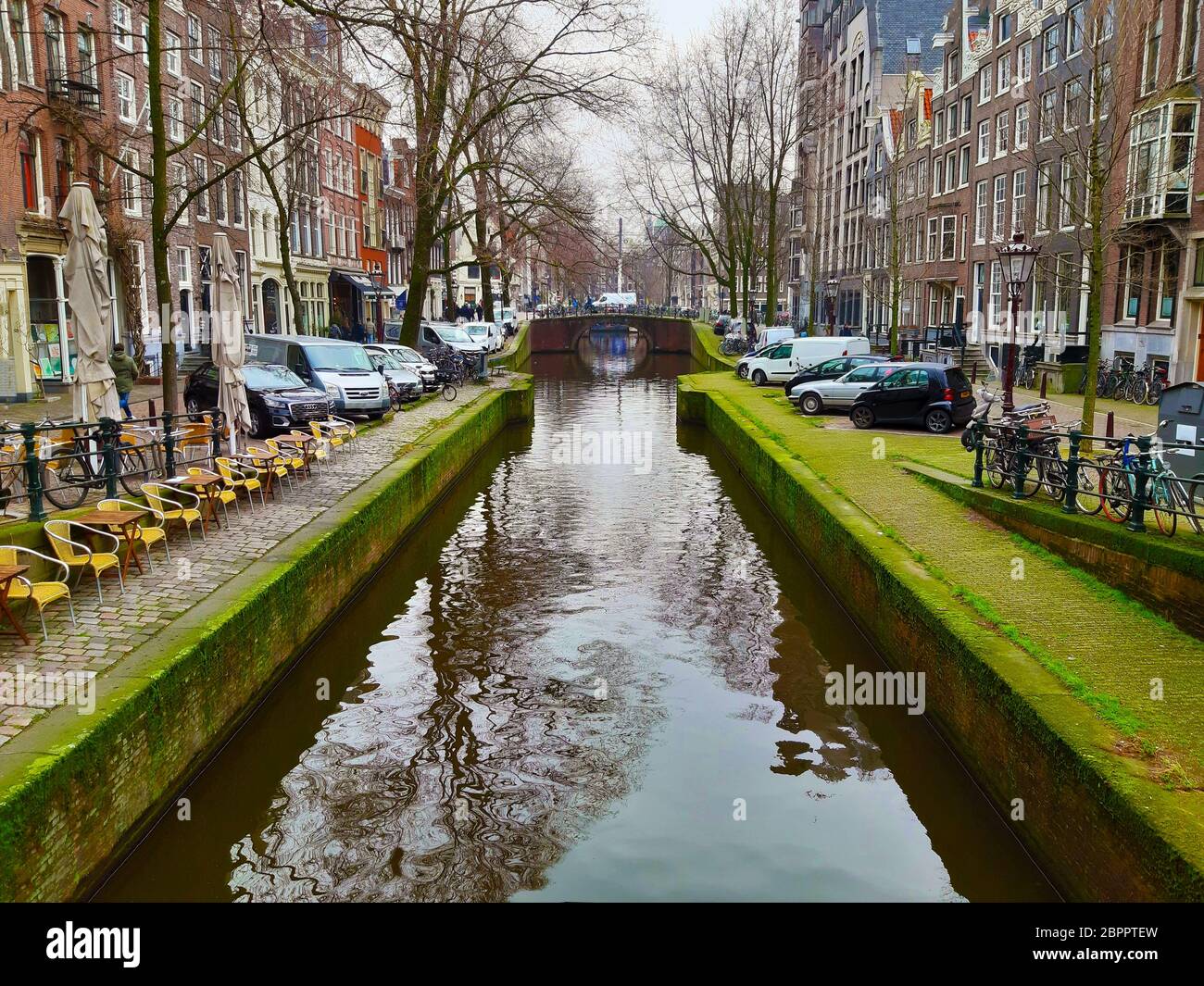 symmetry and charm of the canals of amsterdam among the daily Dutch ...