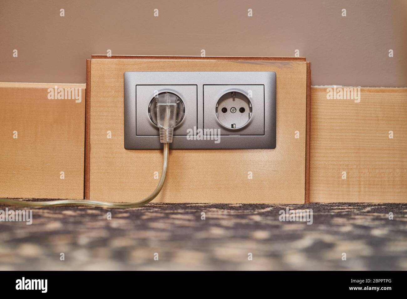 Electric outlet with cable connected Stock Photo - Alamy