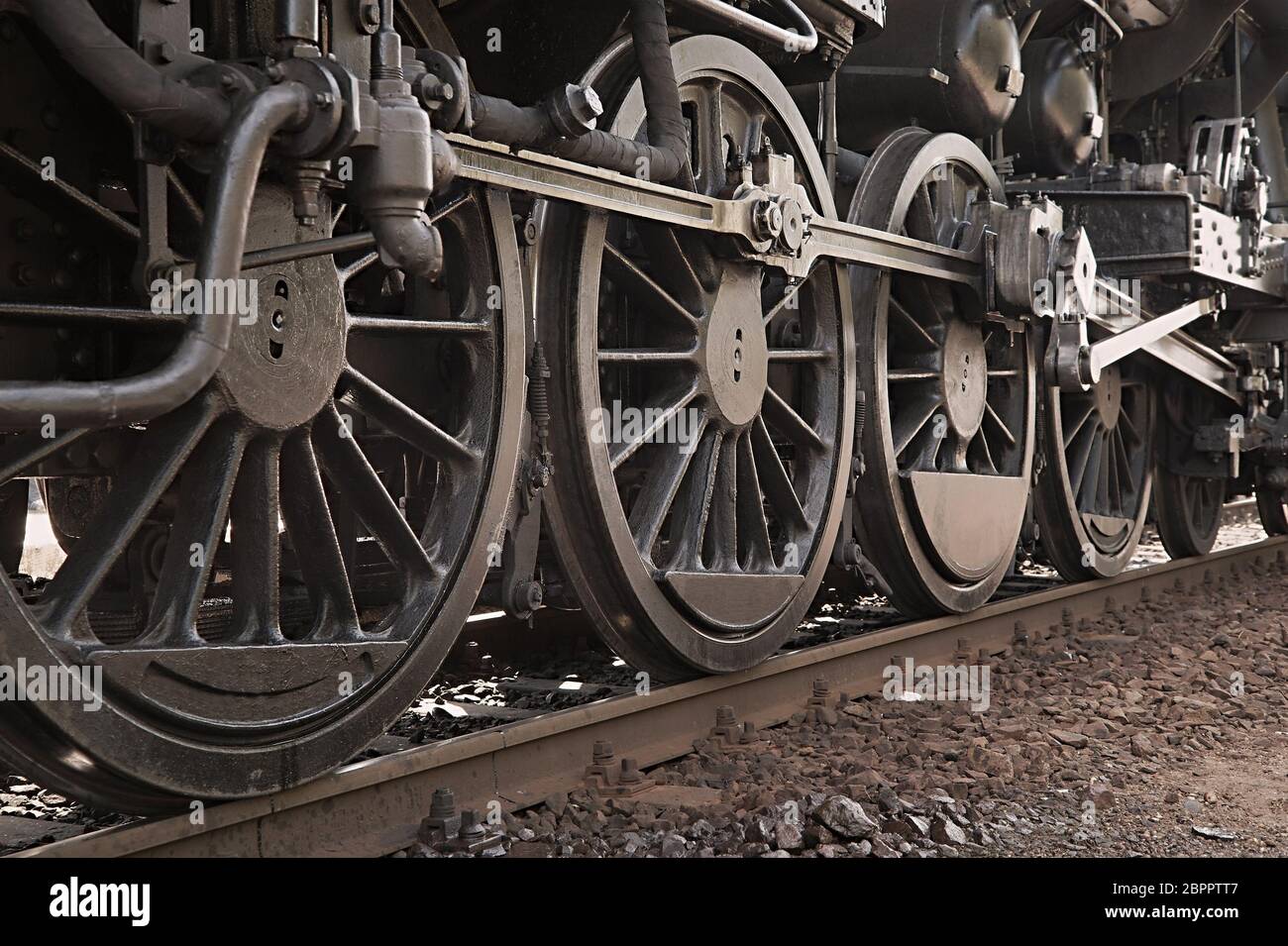 Steam locomotive rolling by close Stock Photo - Alamy