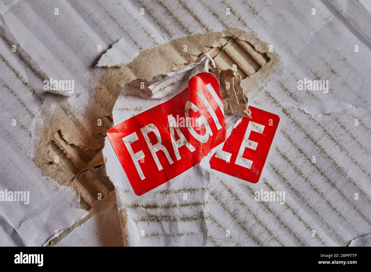 Fragile stamp on a delivery pack Stock Photo - Alamy