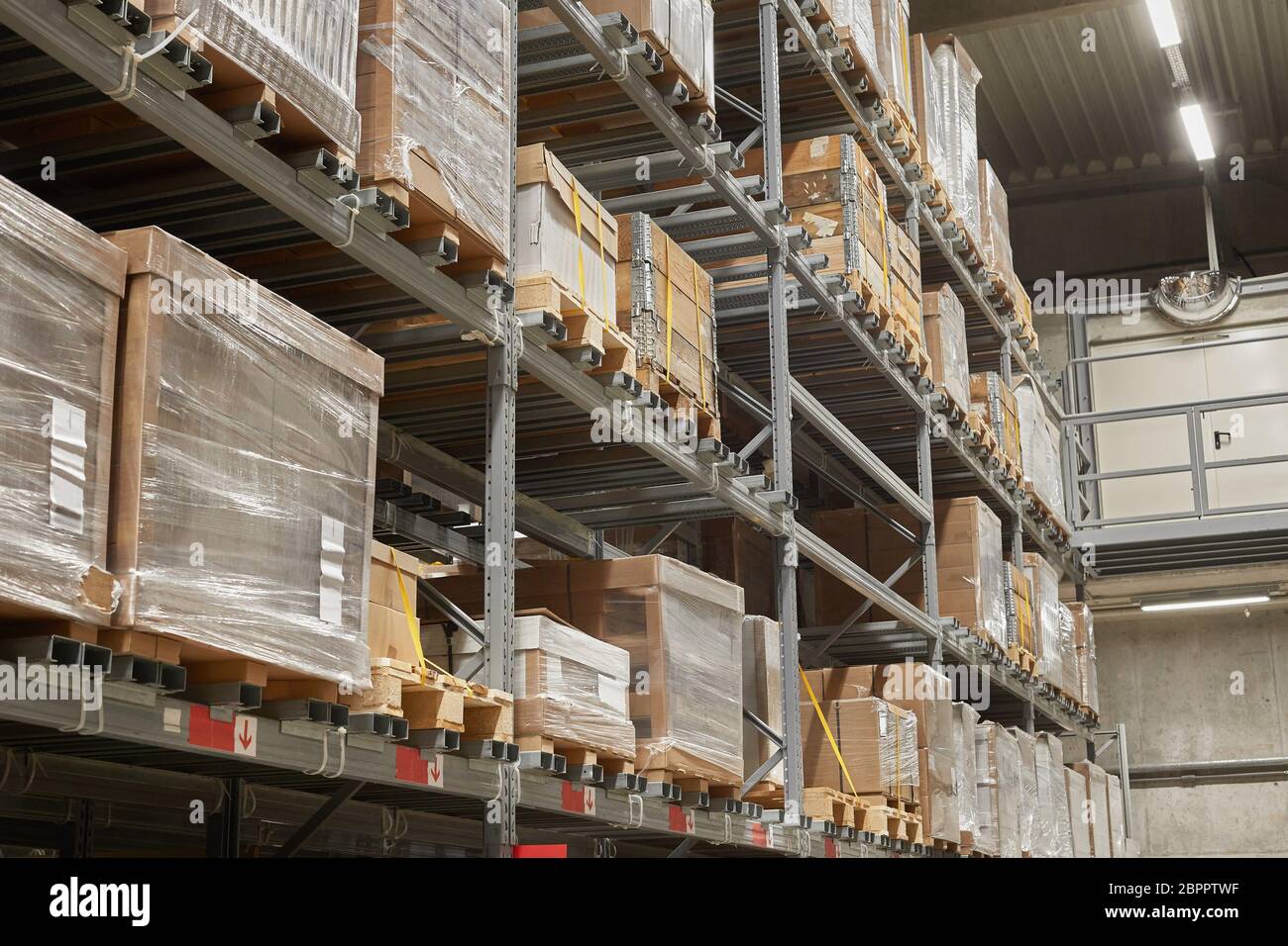 Warehouse with loaded shelves to the ceiling Stock Photo - Alamy