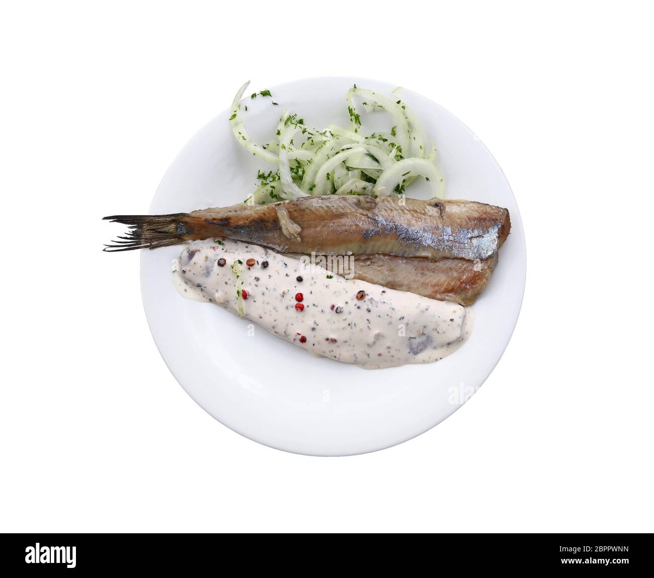 Close up portion of salted pickled herring fish filets with onions and ...