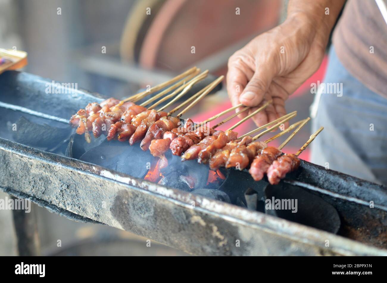 Indonesian grilled bbq meats in wooden skewers Stock Photo - Alamy