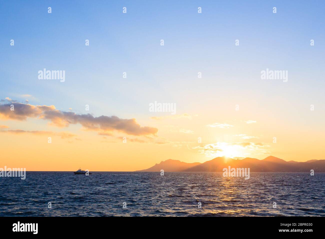 Sunset from the port of Cannes, France. Beautiful french panorama. Sun ...