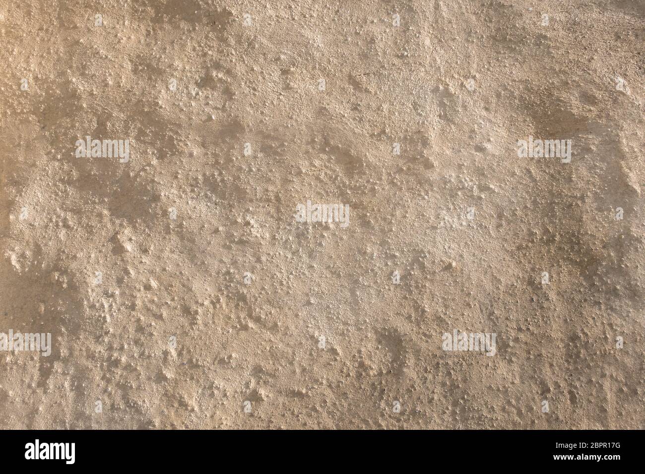 Background of a beige rough concrete wall Stock Photo - Alamy