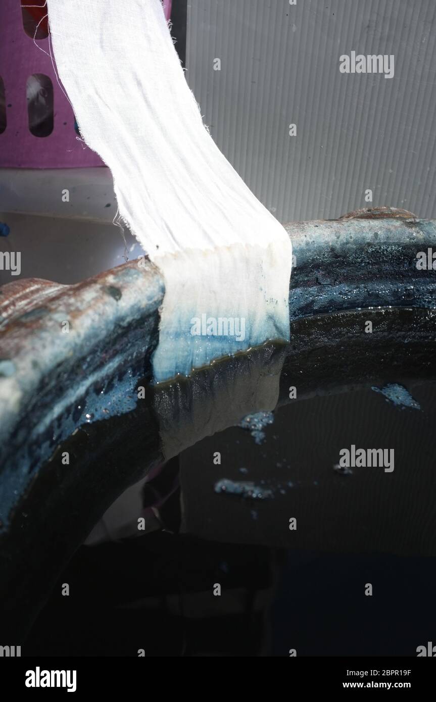 Making indigo dye, Indigo plant fermentation in clay pot . Testing ...