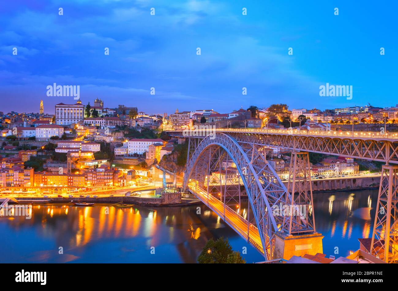 Illuminated evening Porto skyline with famous Dom Luis I Bridge ...