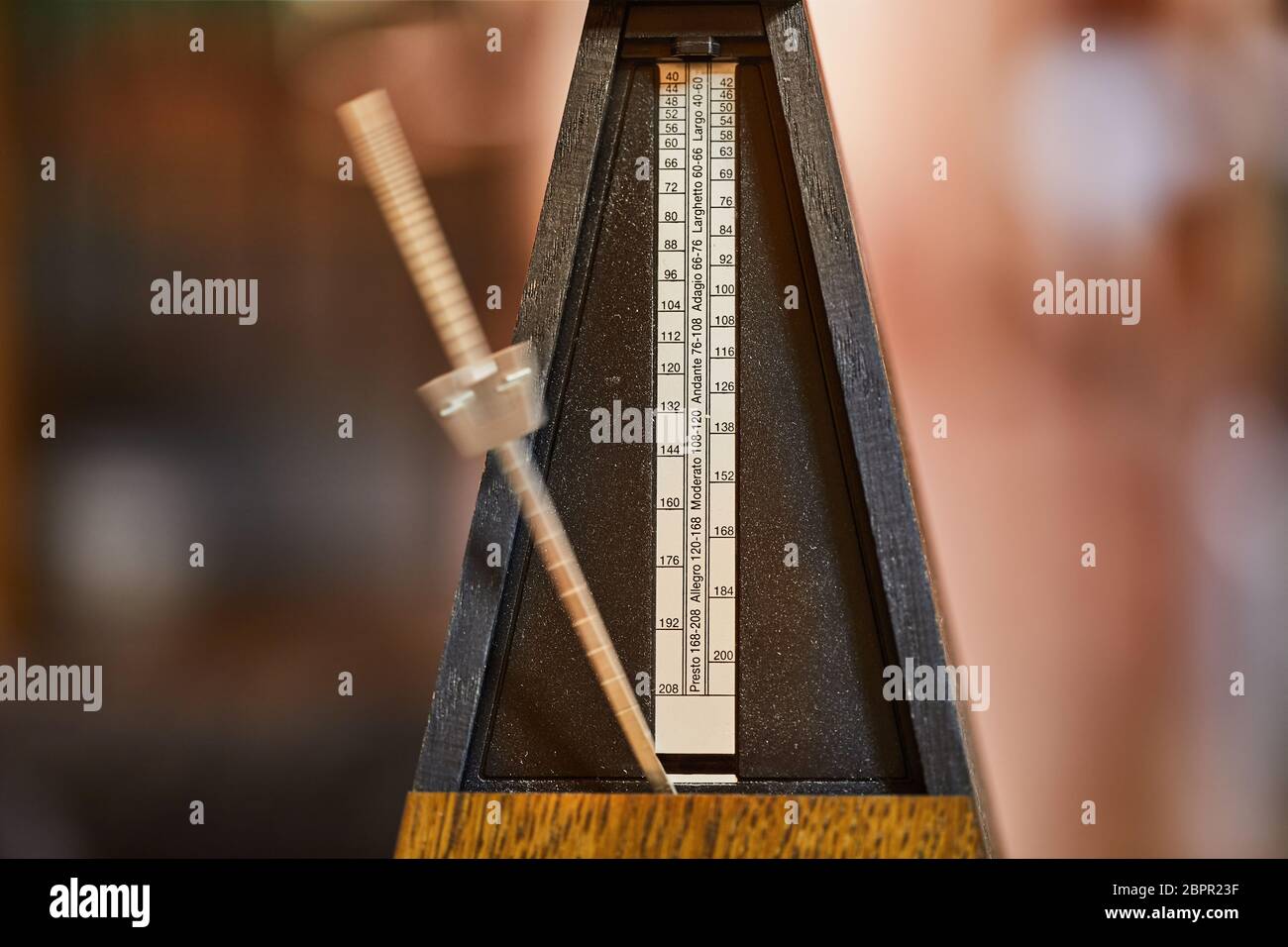Classic metronome in a room with warm tone Stock Photo - Alamy
