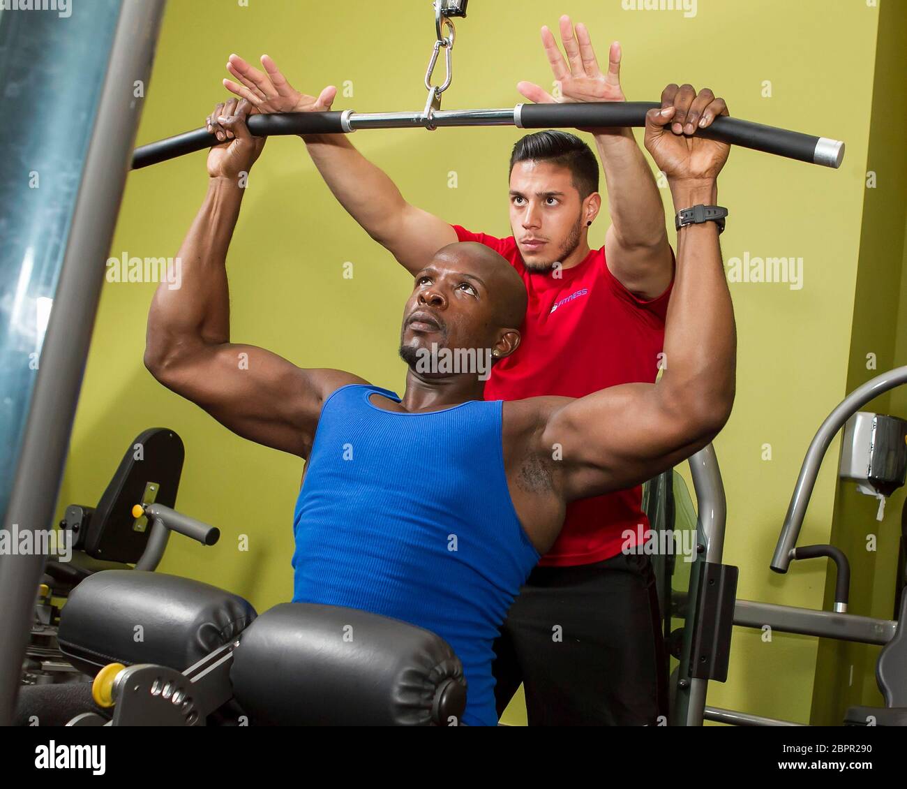 Body builder works out with his trainer at the gym Stock Photo - Alamy