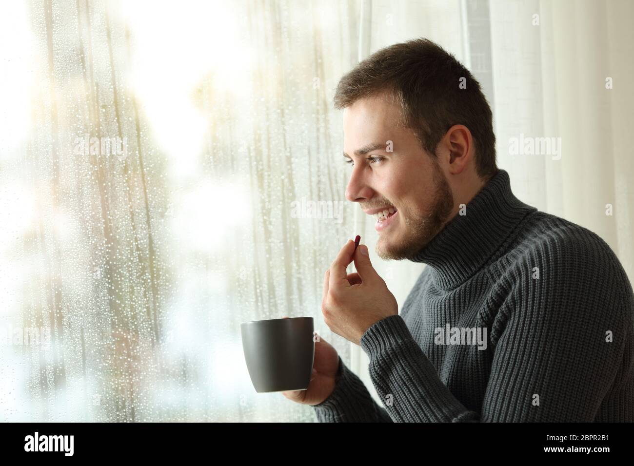 Man taking a pill hi-res stock photography and images - Alamy