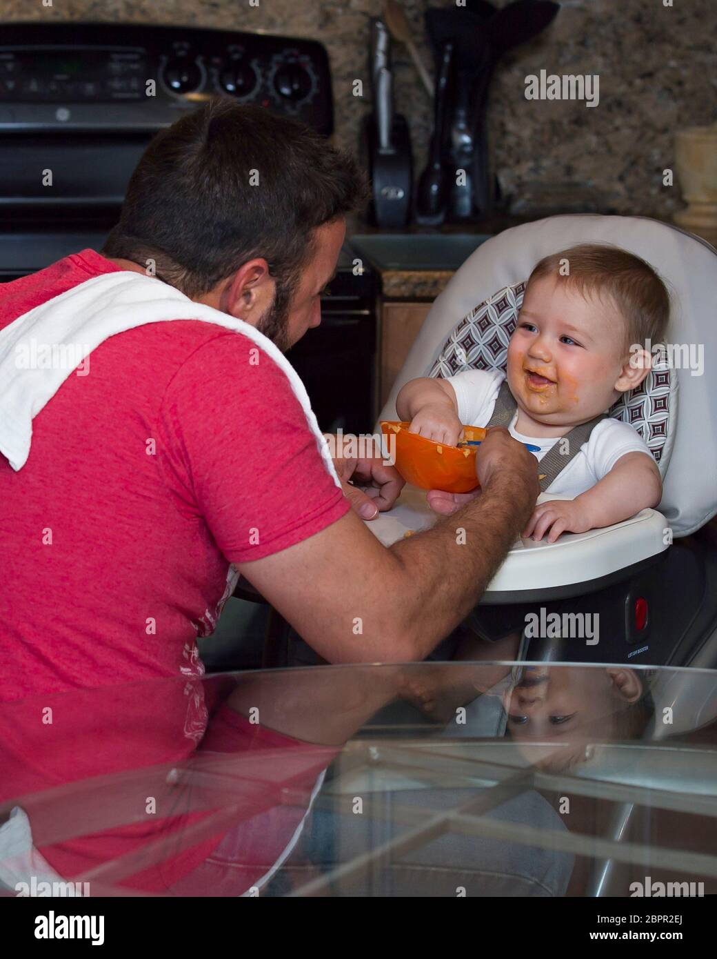 Father feeds baby hi-res stock photography and images - Alamy