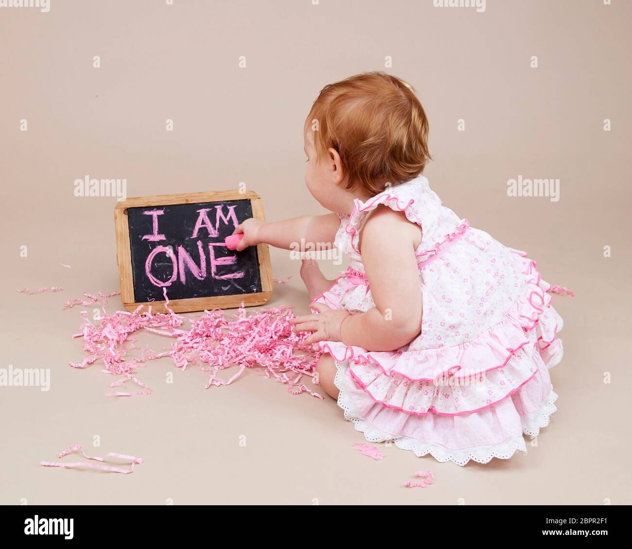 Toddler celebrates her first birthday Stock Photo - Alamy