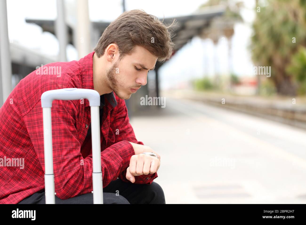 Teenage boy waiting time watch hi-res stock photography and images - Alamy